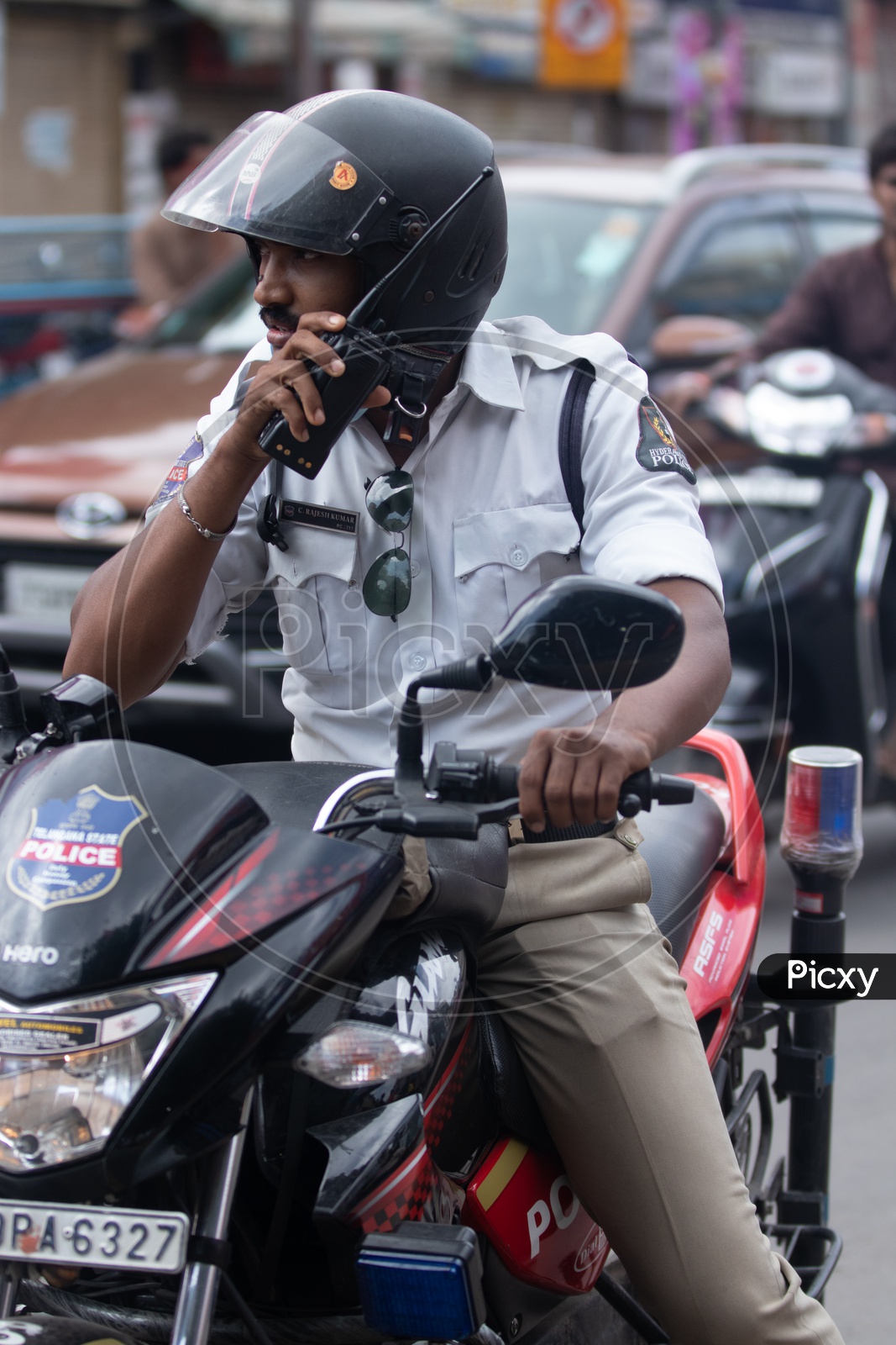 Image of Traffic Police man Speaking In Waki Talki In Traffic-OG583847 ...