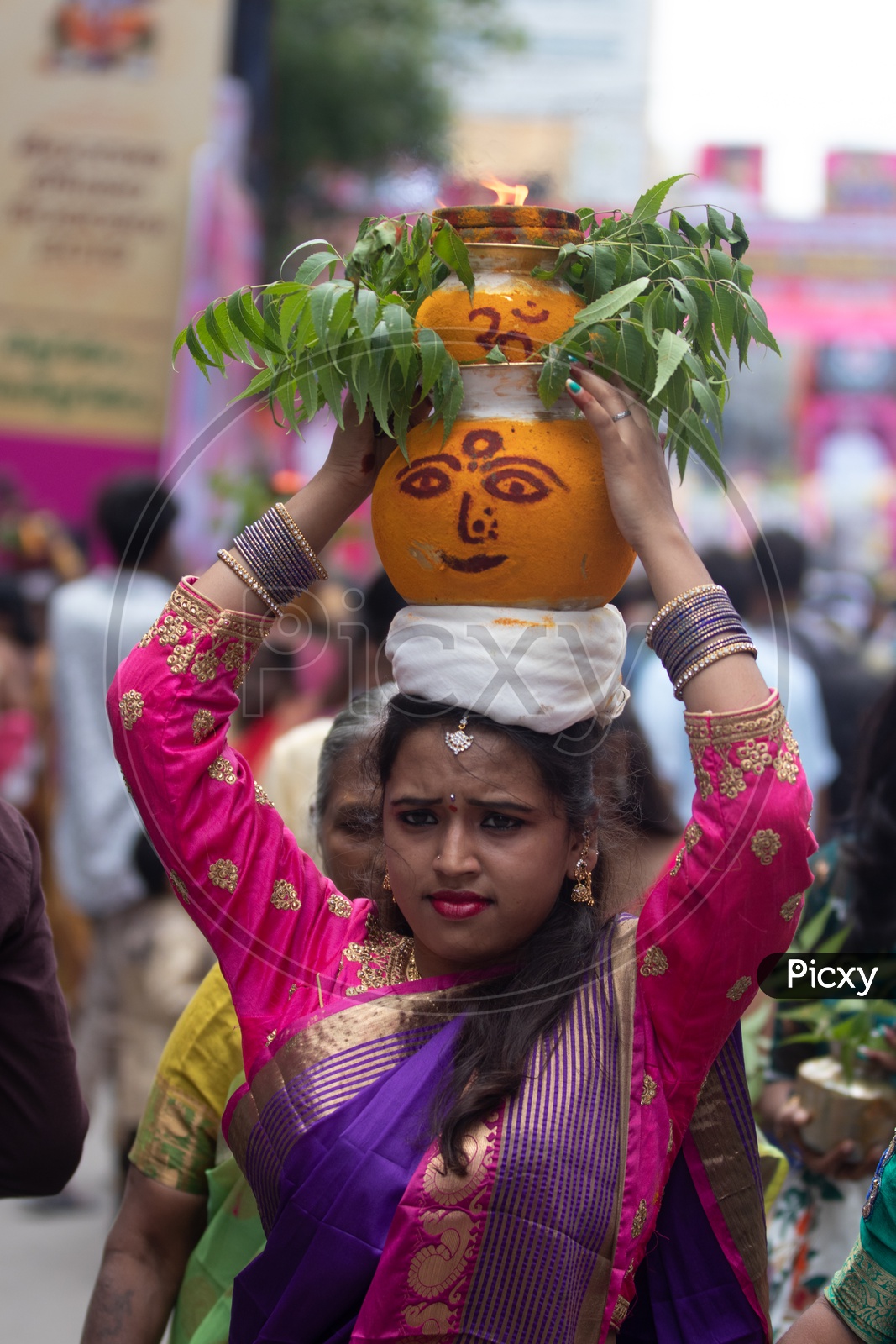 Image of Hindu Devotees Carrying Bonam On Head During Bonalu Festival ...
