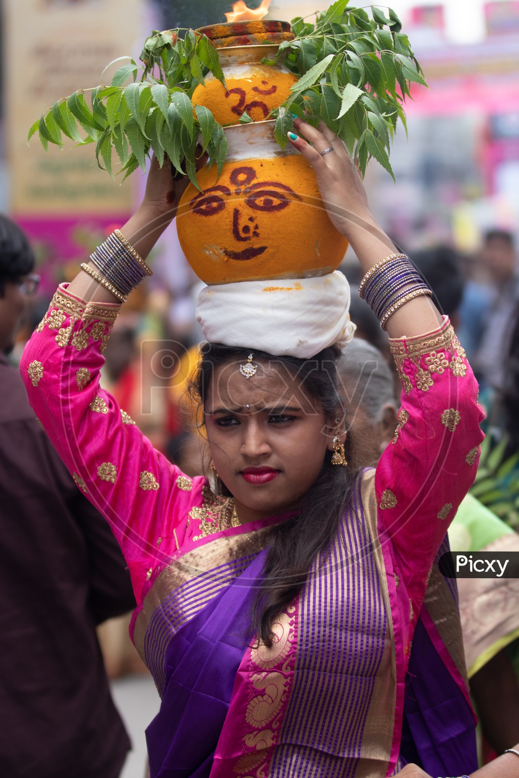 Image of Hindu Devotees Carrying Bonam On Head During Bonalu Festival ...