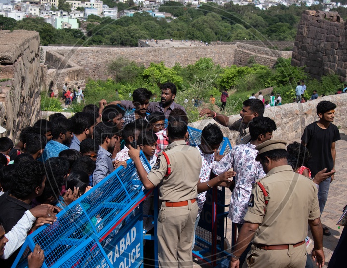 Image of Police man Controlling The crowd Of Devotees At Golconda Fort ...