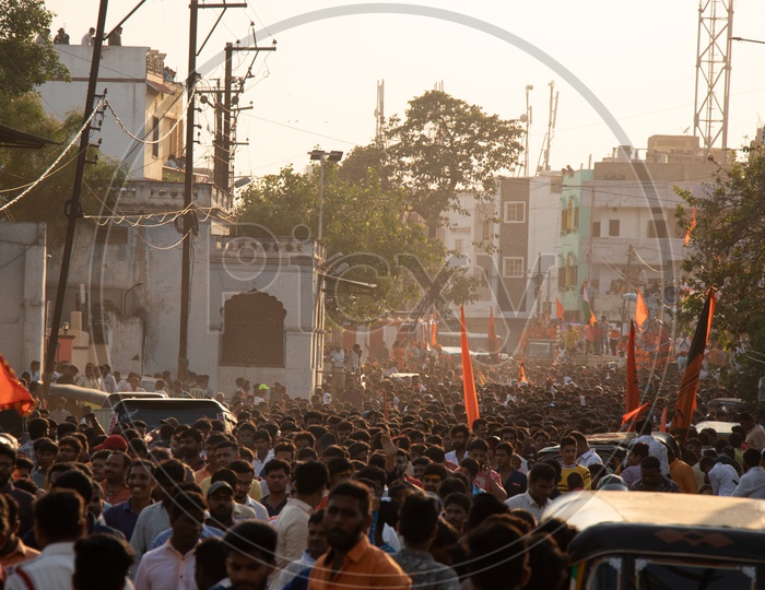 Image of Crowd Of Hindu devotees Carrying Saffron Flags At Sri Rama Navami Shoba Yatra-RE150937 ...
