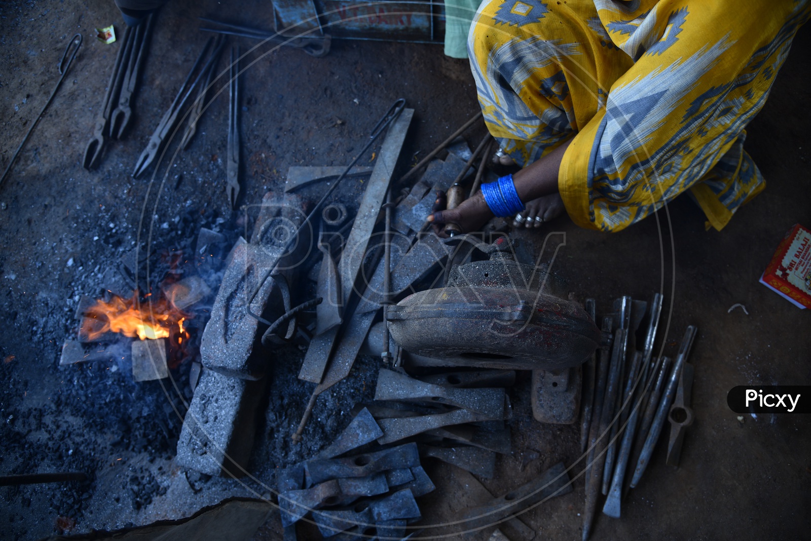 Image of Indian Blacksmith Forges Hot Metal-VY052290-Picxy