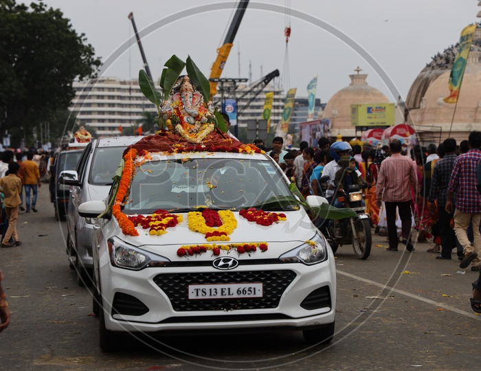 Image of Lord Ganesh Idols On Car top During Ganesh Visarjan Event ...