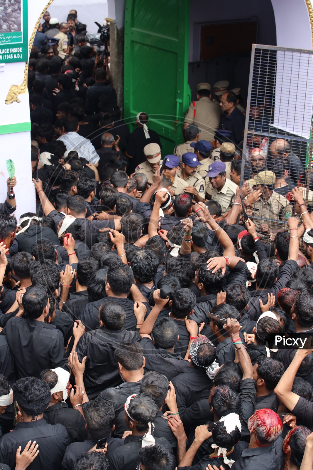 Image of Crowd Of Muslim Devotees Offering Mourns By flagellation ...