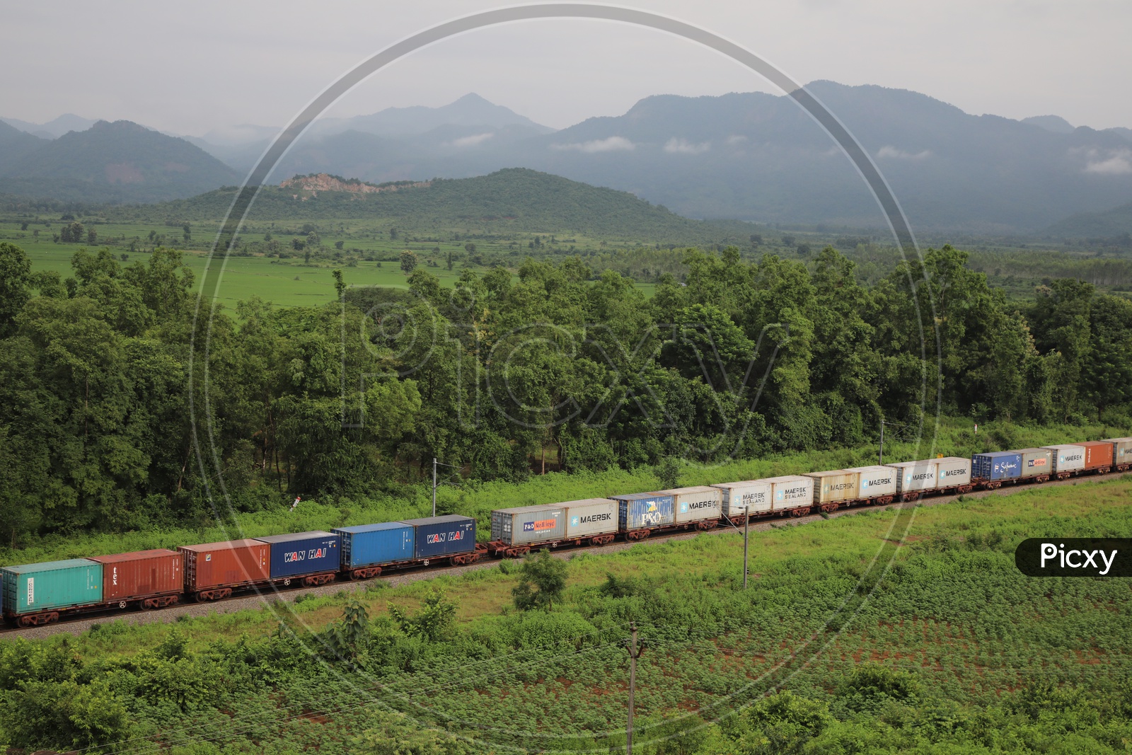 Image of Aerial View Of Indian Railway Train Running On Track At a ...