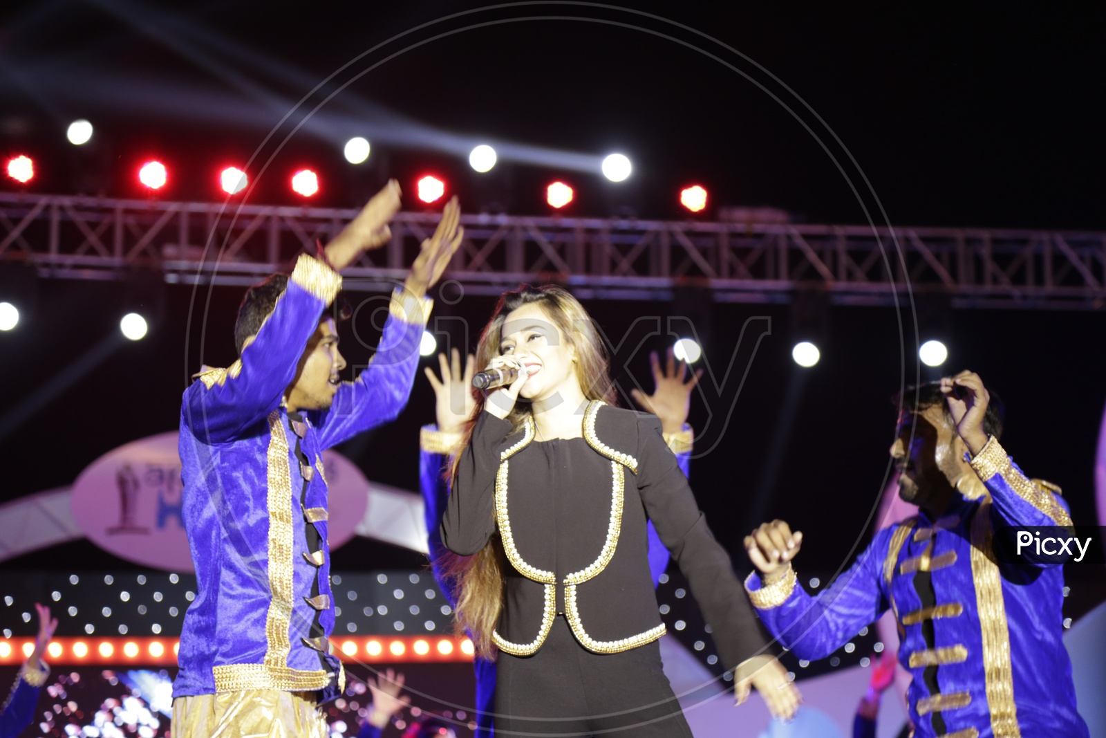 Image of Beautiful Woman Performing Live Singing On Stage At APICON ...