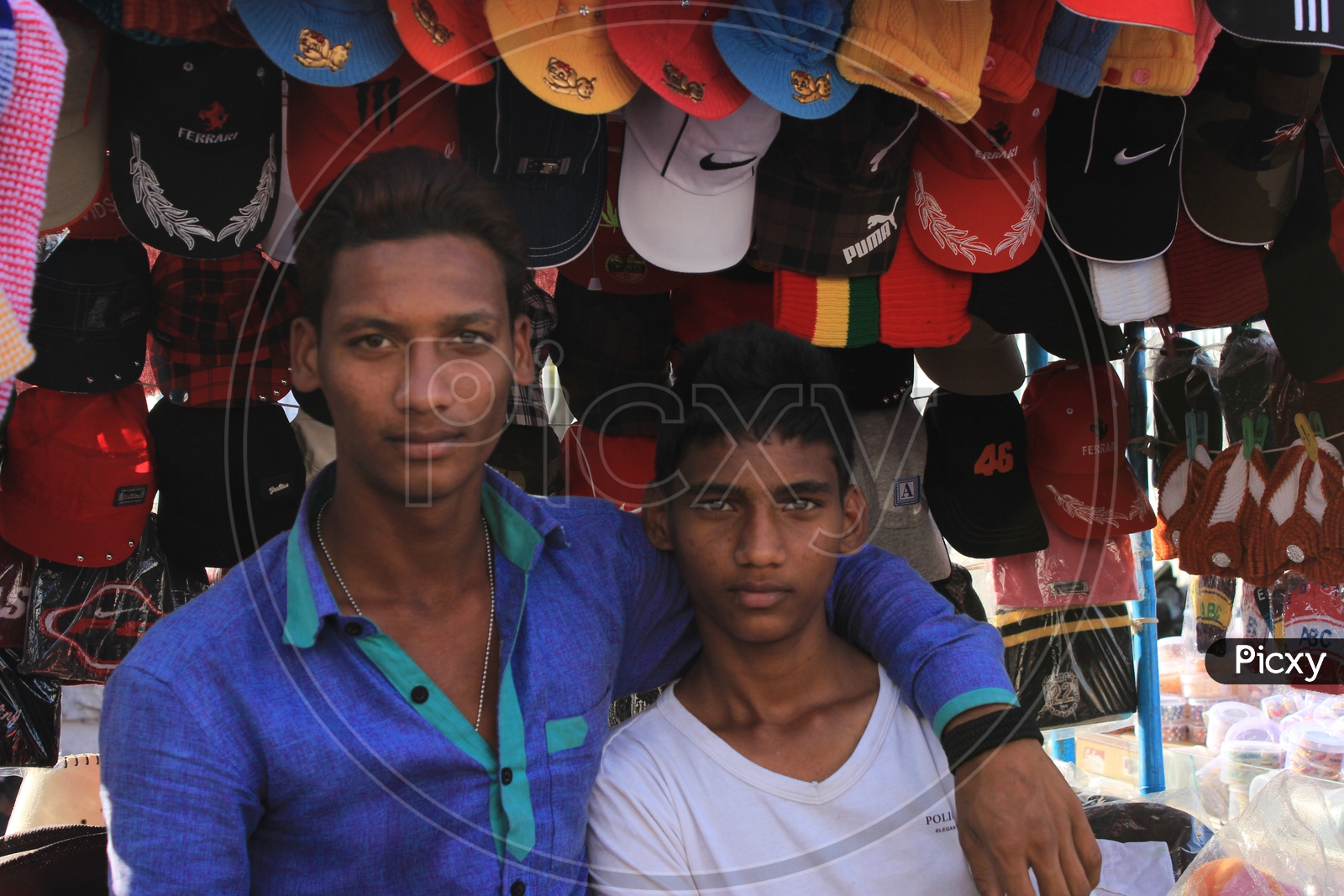 Image of Young Boy Selling Caps At a Stall Near Charminar-SB717909-Picxy