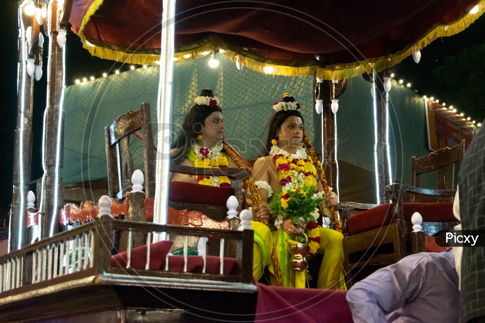 Image of Men dressed as Lord Ram and Laxman riding on a Rath during ...