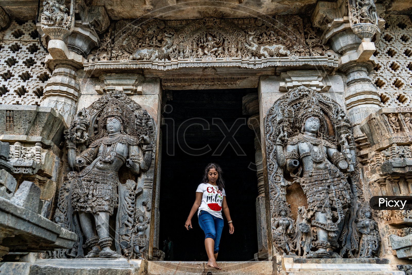 Image of Young Indian Woman Walking To Ancient Hindu Temple With ...