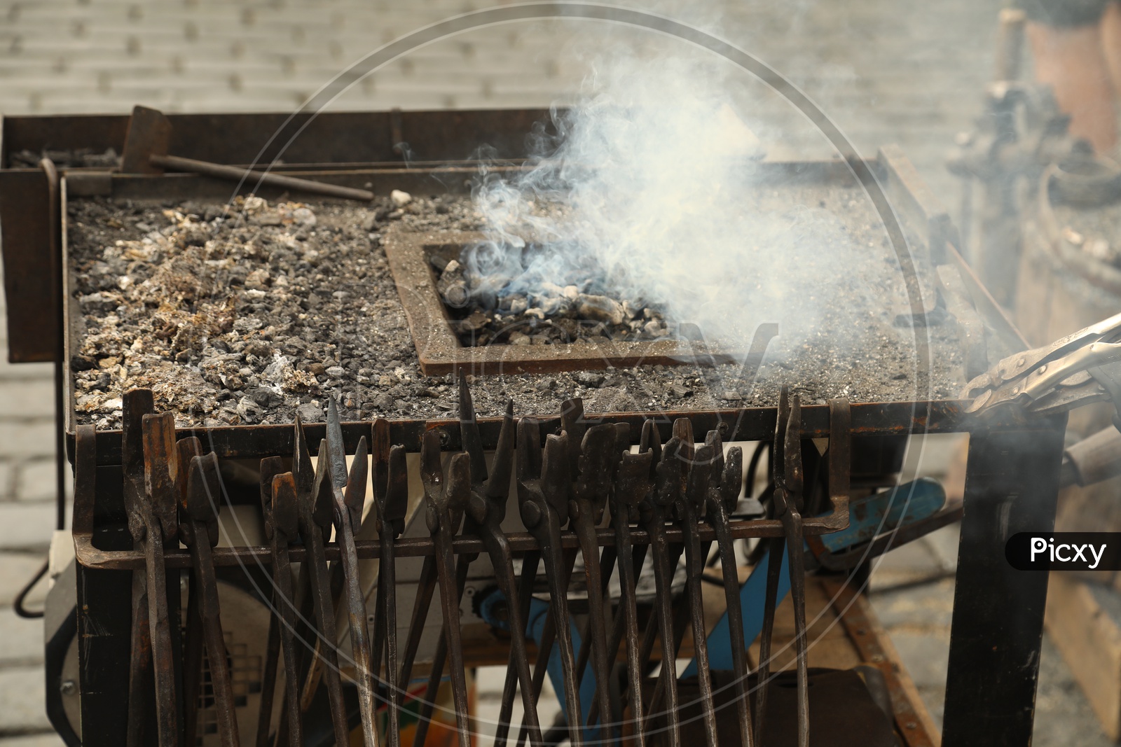 Image of Coal Burning in a barbeque Stand-JV720103-Picxy