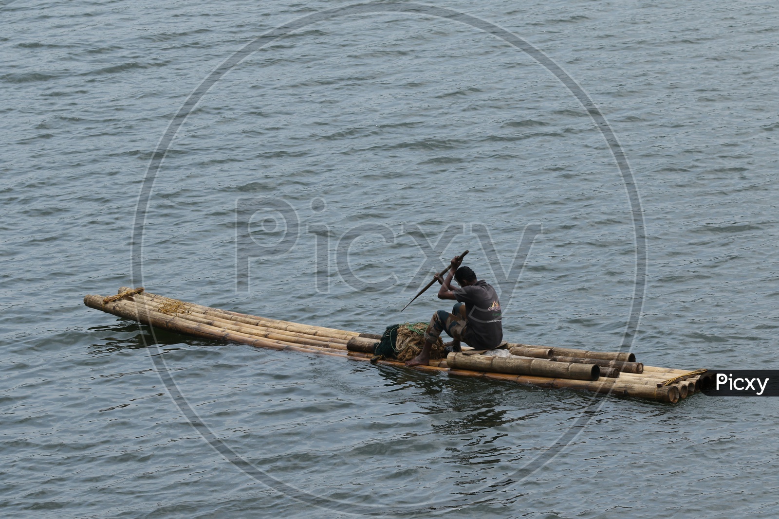 Image of Raft in a river at parambikulam tiger reserve-VZ804456-Picxy