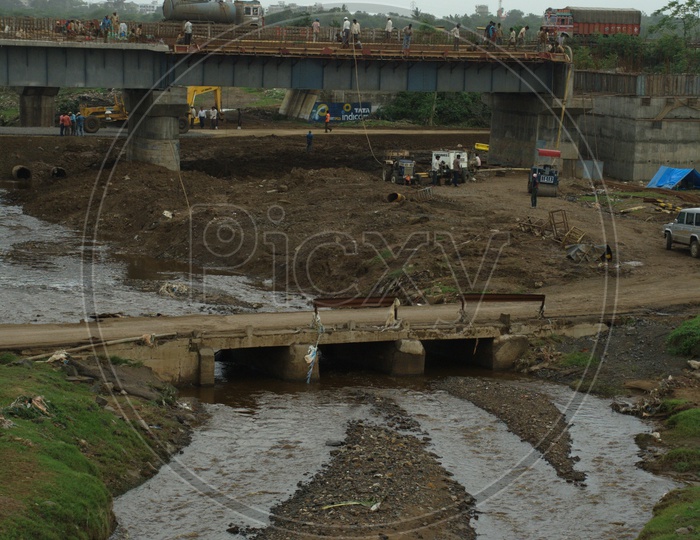 Image of Construction of a bridge alongside the water stream-MN996434-Picxy