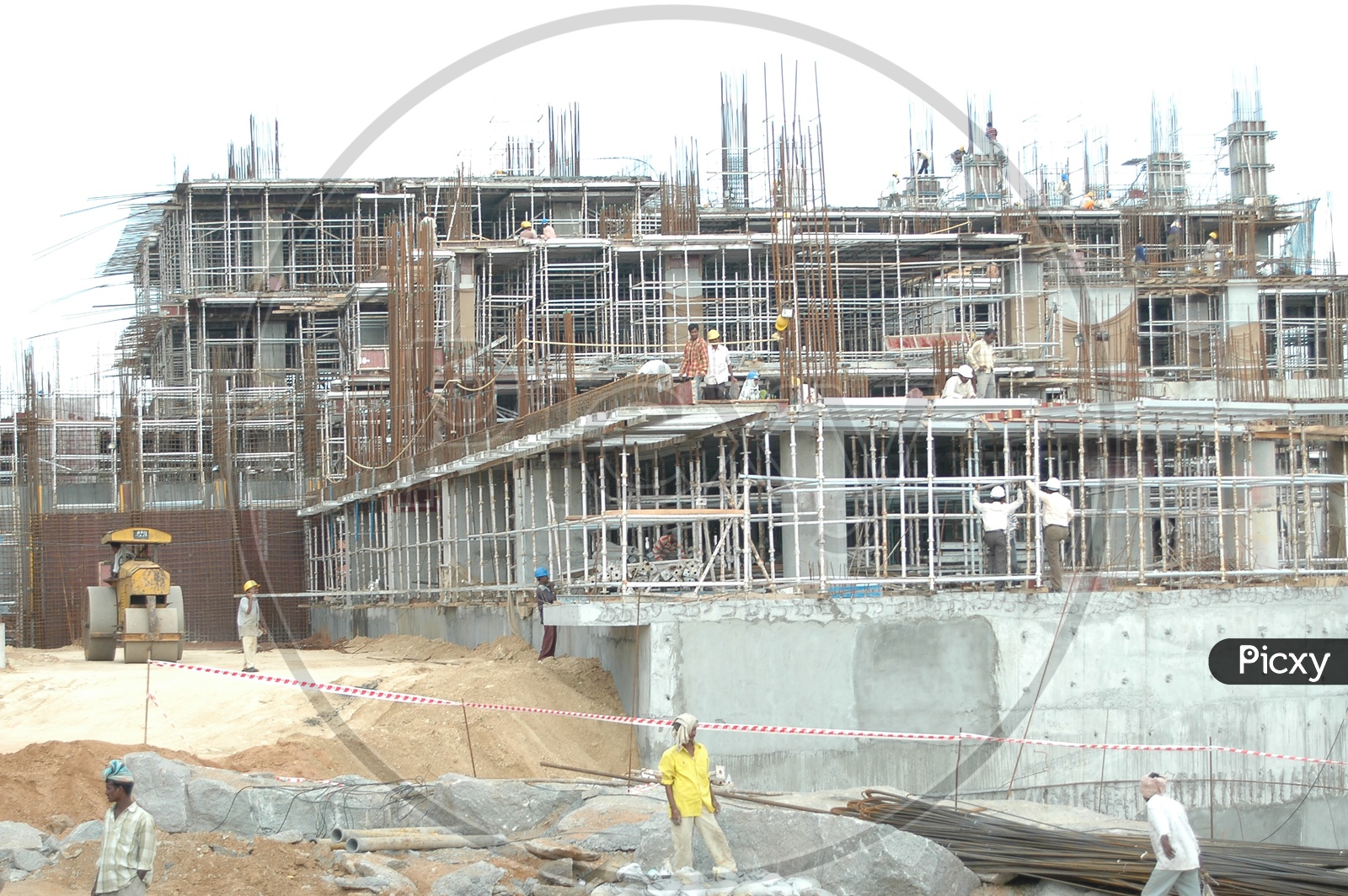 Image of Workers working in a building which is under construction ...