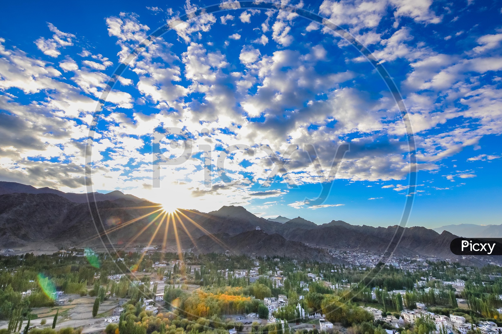 Image of Landscape of a sunburst alongside the hills-NM002011-Picxy