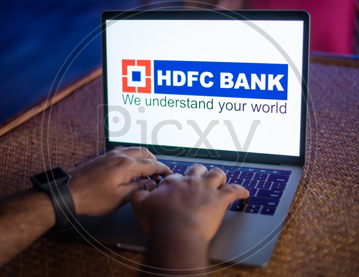 Image of Indian Man Accessing HDFC Bank Portal in Laptop-FB910267-Picxy
