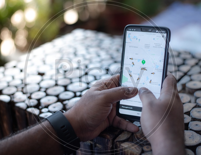 Image of Indian Man Accessing Rapido App For Booking Bike Taxi In Smart ...