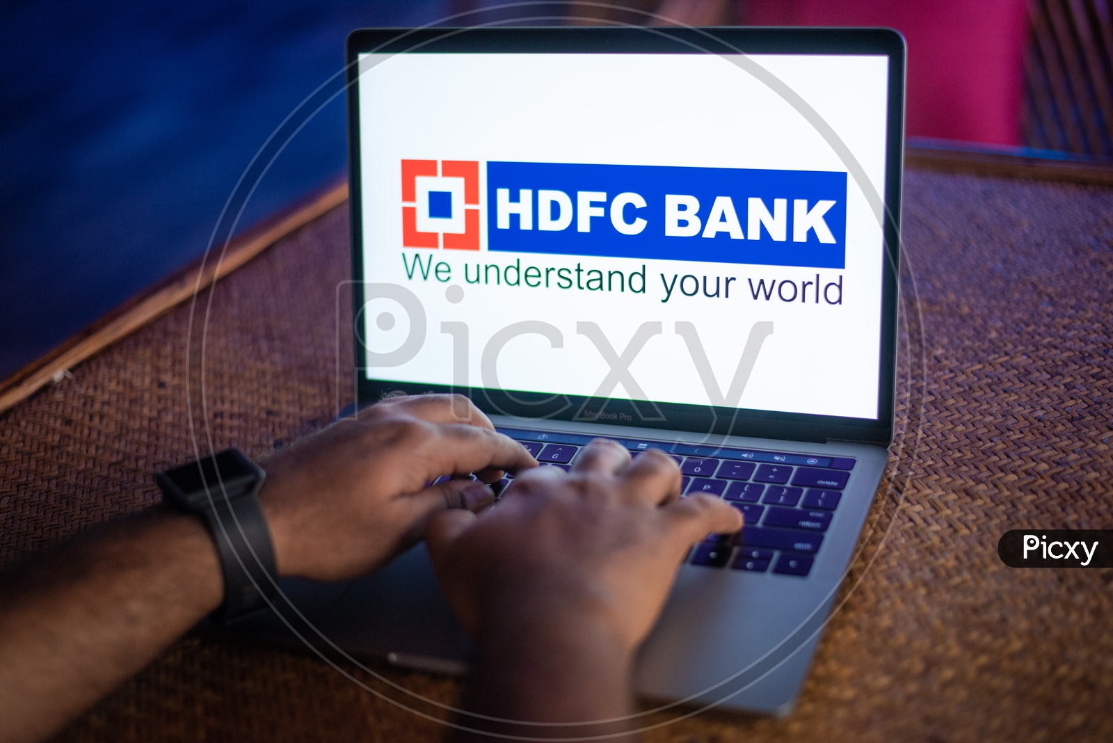Image of Indian Man Accessing HDFC Bank Portal in Laptop-FB910267-Picxy