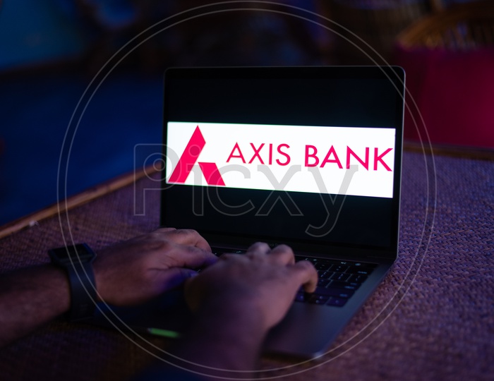 Image of Indian Youth Accessing Online Banking Of AXIS BANK in Laptop ...