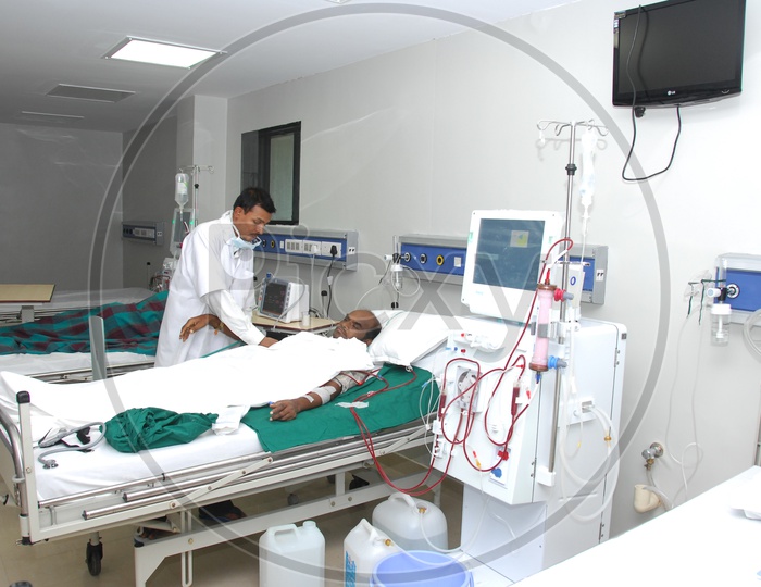 Image of Doctor checking Patient in the ICU - Movie scene-YN599852-Picxy