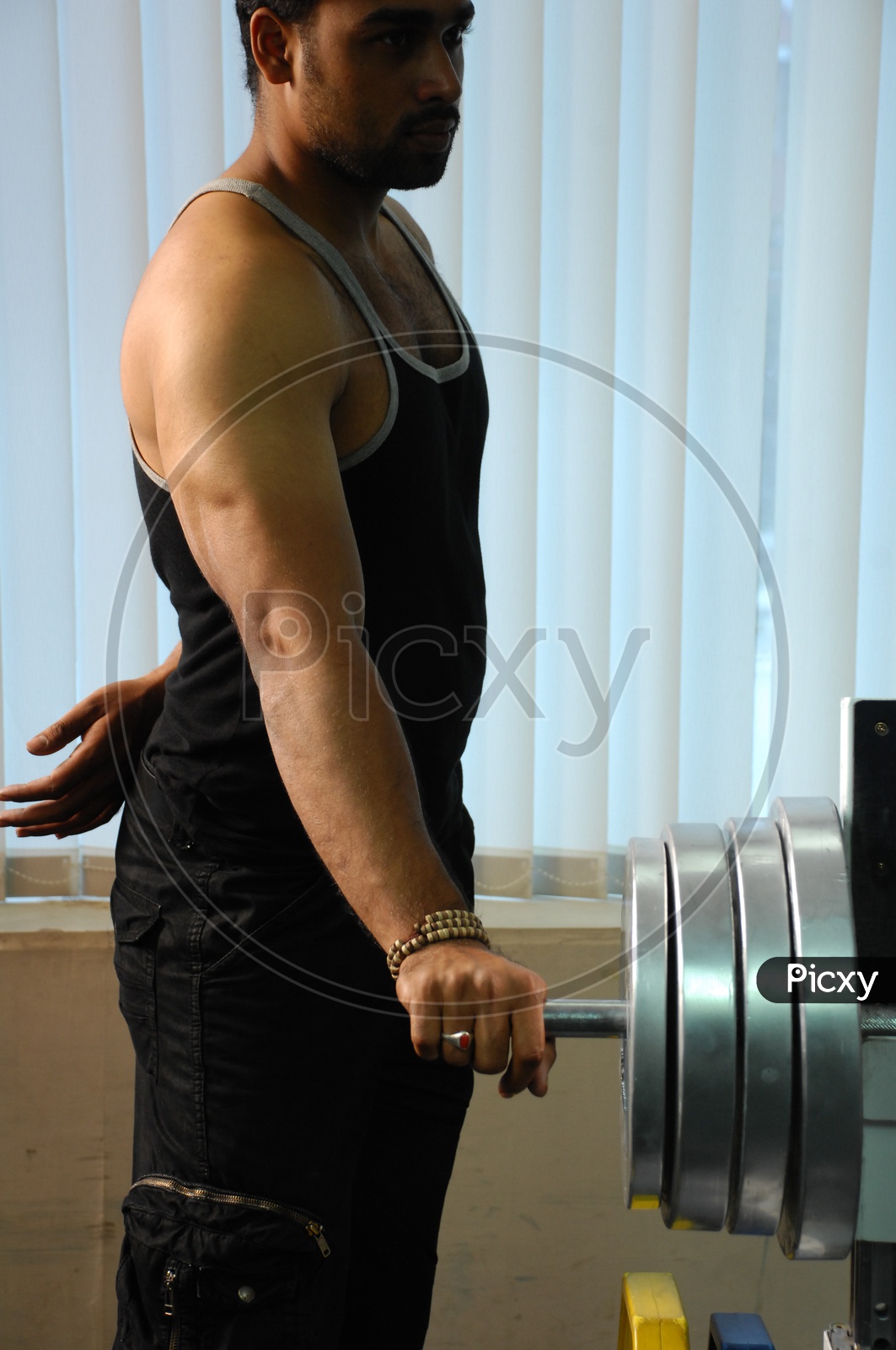 Image of Indian man exercising at a gym-TR557566-Picxy