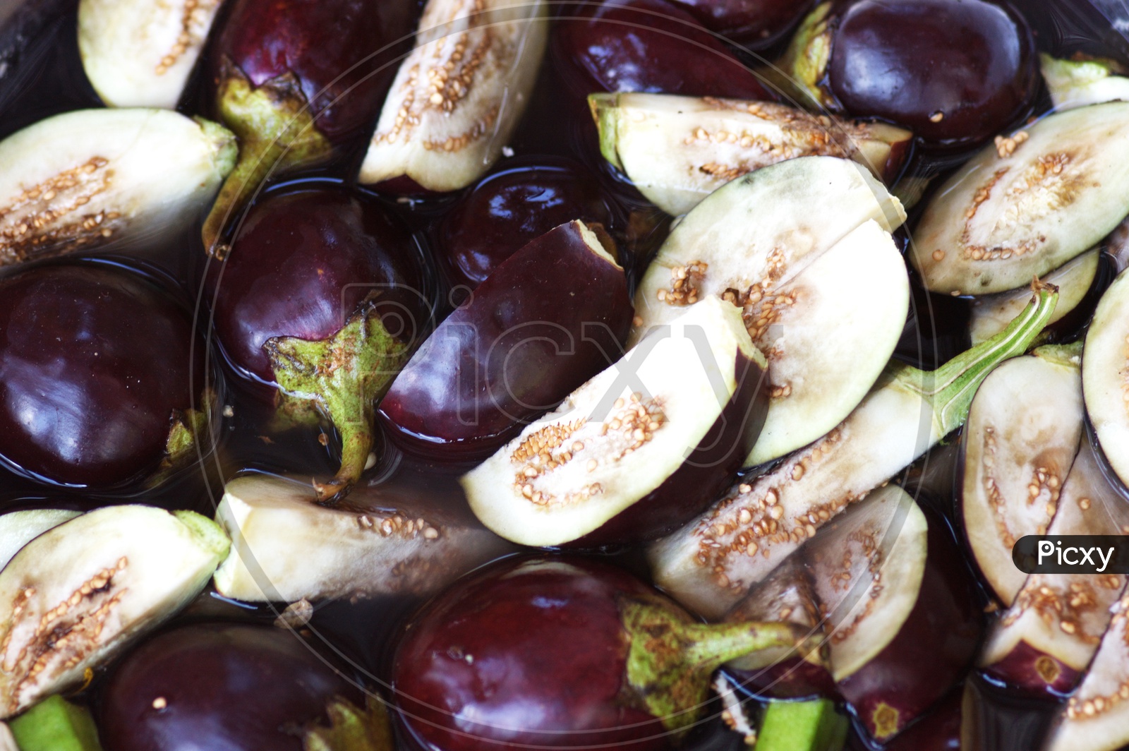 Image of Brinjal cut into pieces-SF901229-Picxy