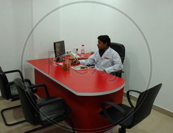 Image of Doctor talking to the patient in the doctor cabin-EP066652-Picxy