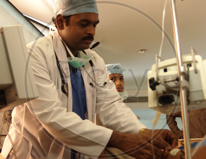 Image of Doctor Monitoring Patient Condition-WC608376-Picxy