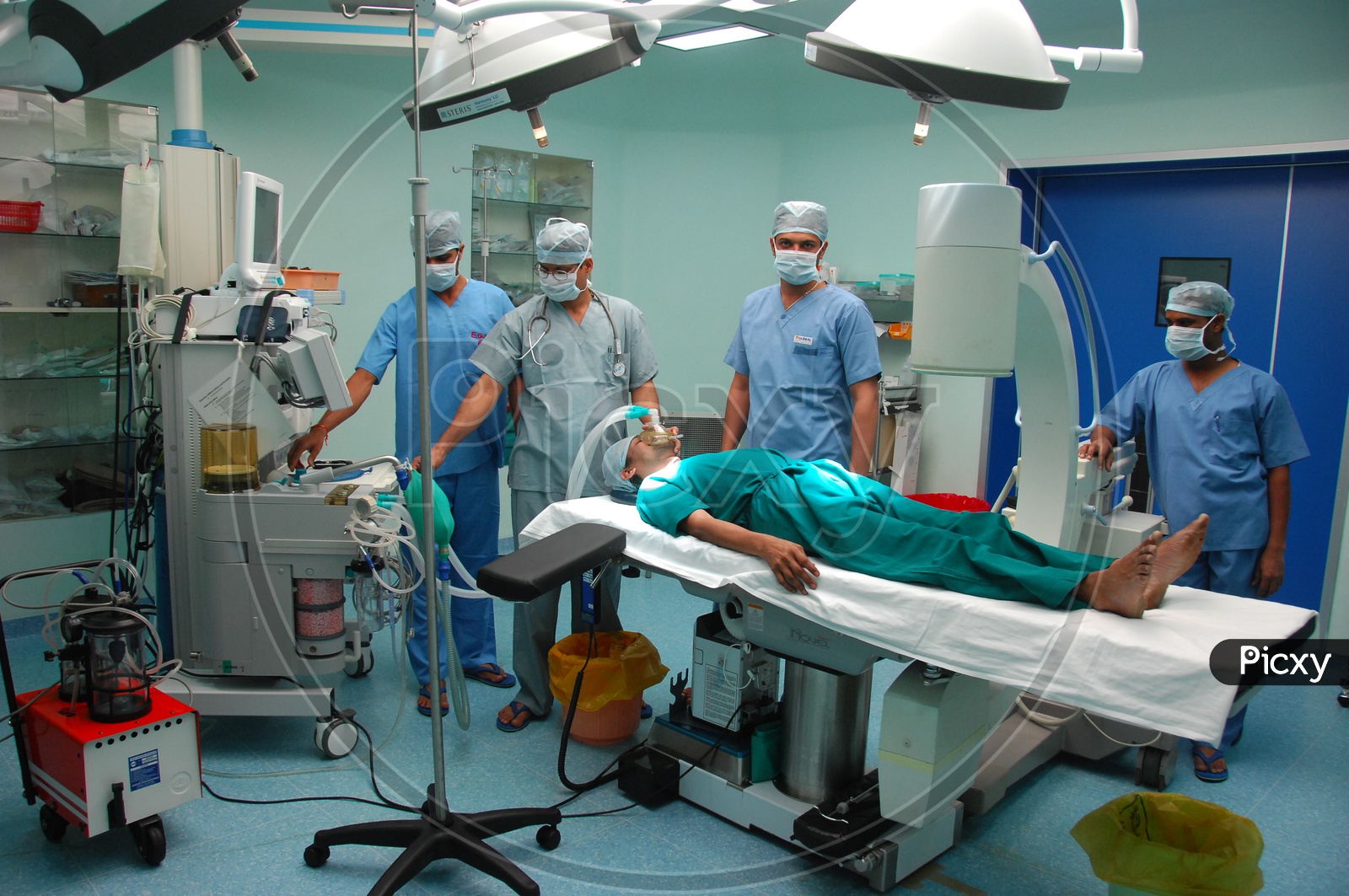 Image of Doctors performing operation to a patient in Operation theatre ...
