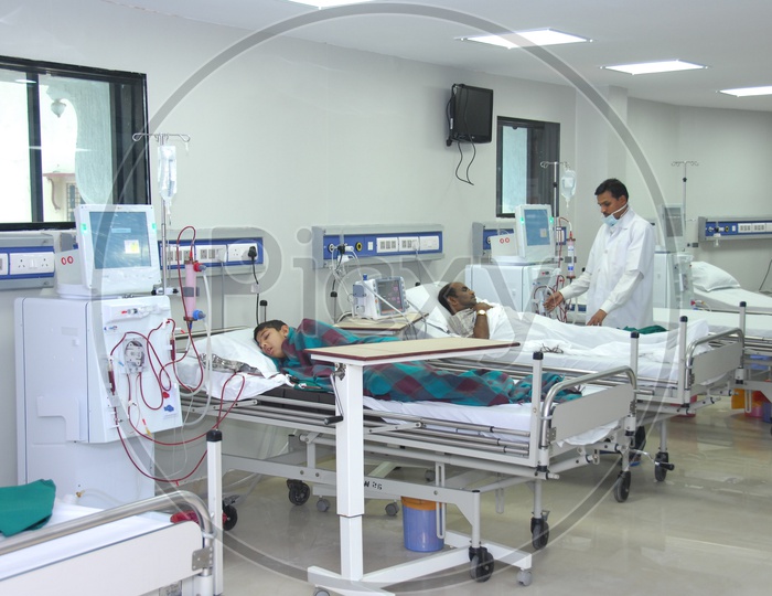 Image of Doctor with a patient in the ICU - Movie scene-TO982440-Picxy