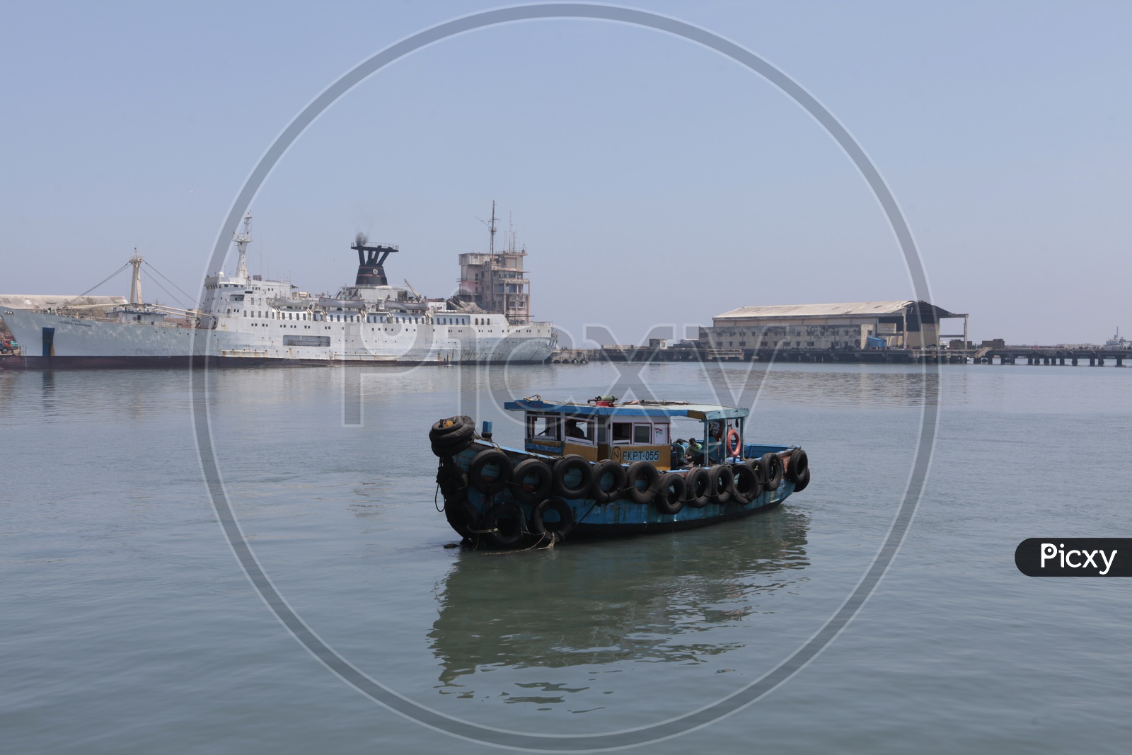 Image of Local Boat with tyres attached sailing on the sea-MG271732-Picxy
