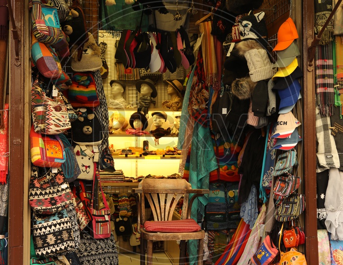 Image of A shop with caps and hand bags on display-XE588231-Picxy