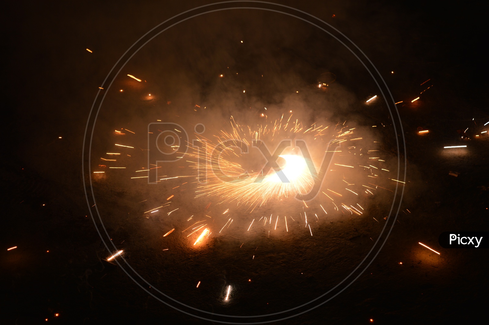 Image of Indians Celebrating Diwali By Firing Cracker Ground Chakkars ...