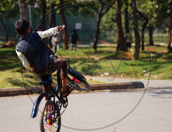 Image of Kid Stunting on Bicycle-UW108592-Picxy