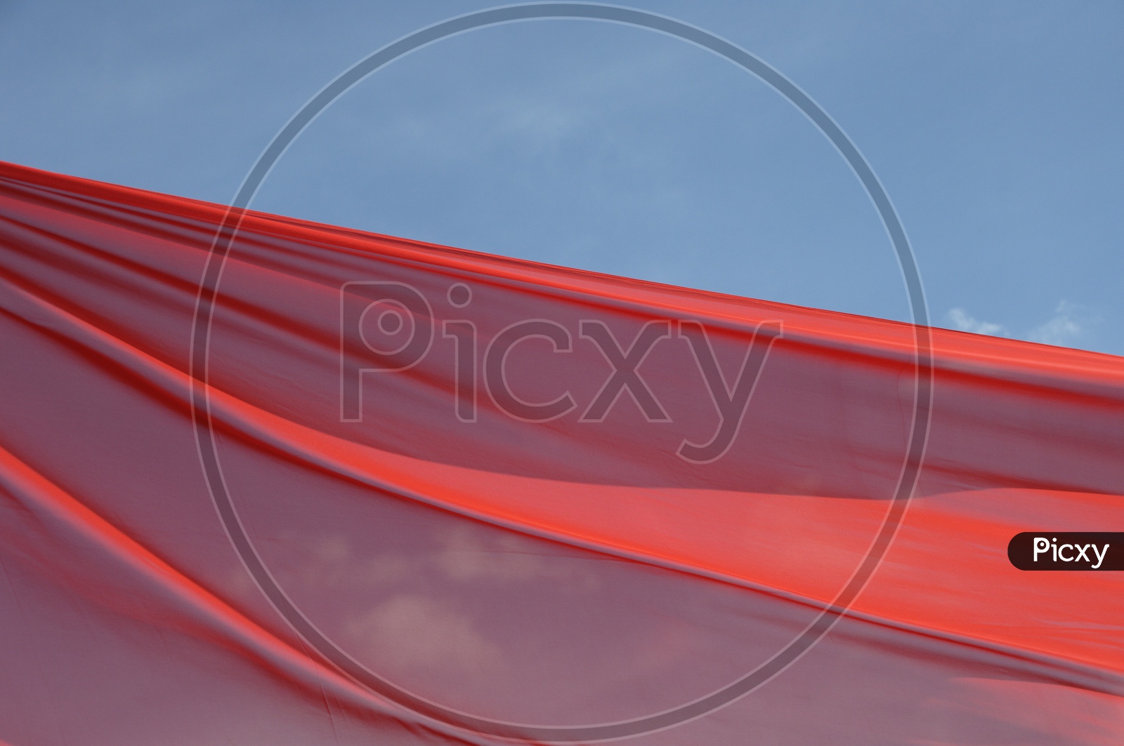 Image of A Red Silk Cloth Waving Patterns In Air Composition Shot ...