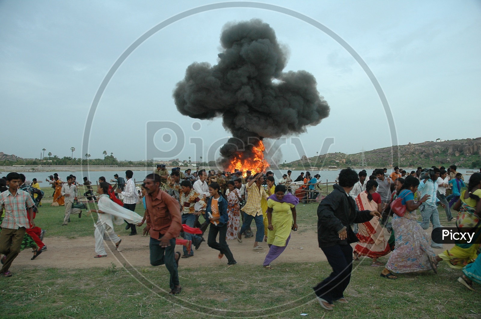 Image of People are running during a Bomb Blast in a an open area ...