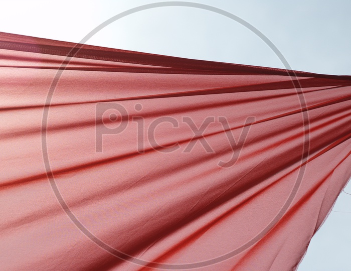 Image of A Red Silk Cloth Waving Patterns In Air Composition Shot ...