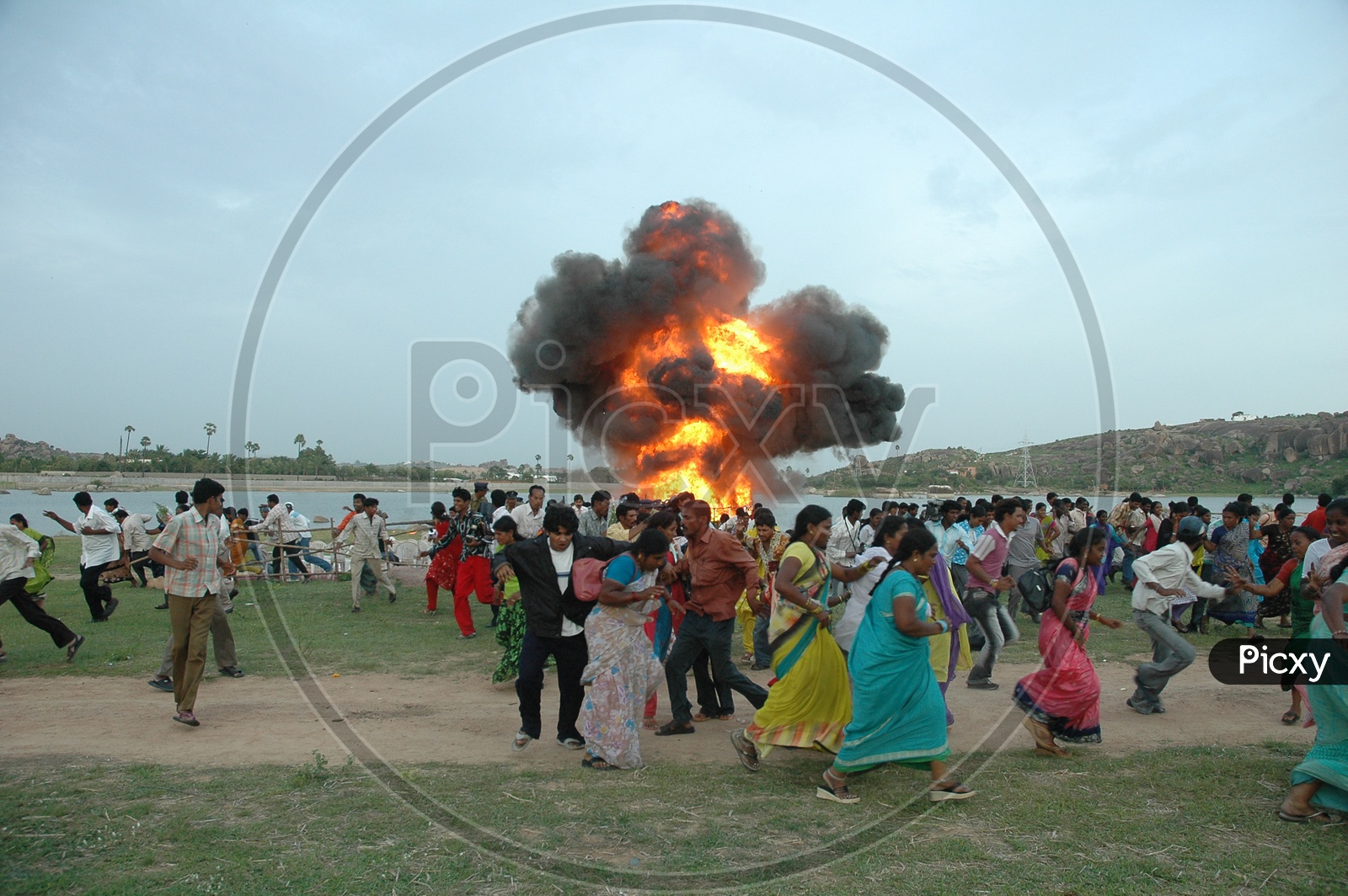 Image of People are running during a Bomb Blast in a an open area ...