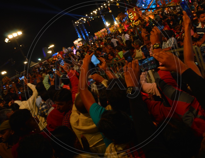 Image of People taking photographs of a show in NTR Stadium-YW909221-Picxy