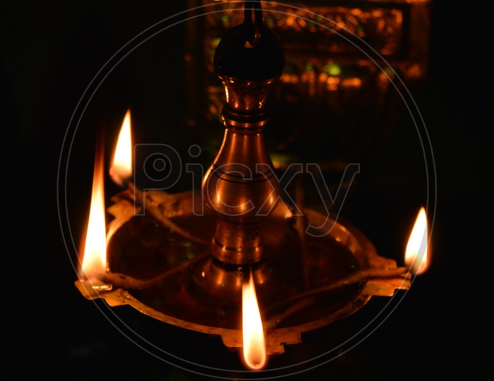 Image of Dias lit With Oil in Indian Brass Dia Stand-XC897634-Picxy
