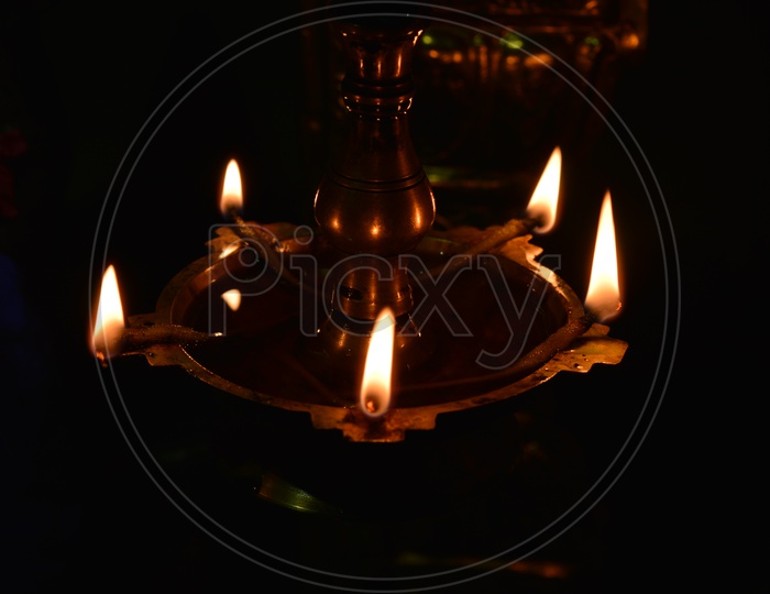 Image of Dias lit With Oil in Indian Brass Dia Stand-XC897634-Picxy