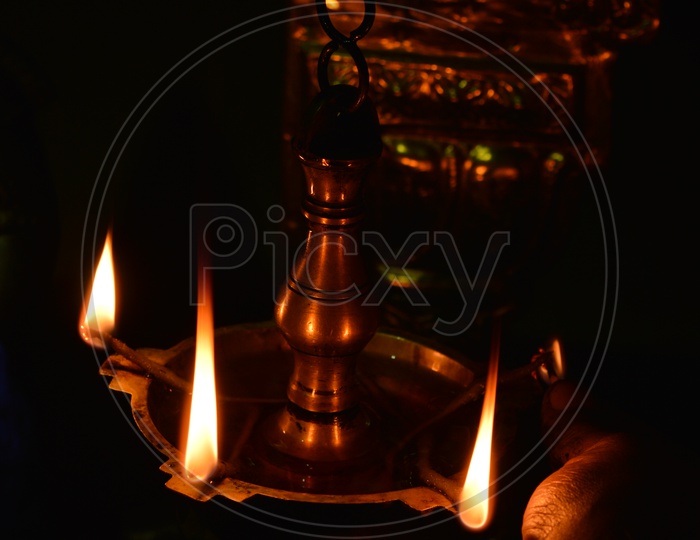Image of Dias lit With Oil in Indian Brass Dia Stand-XC897634-Picxy