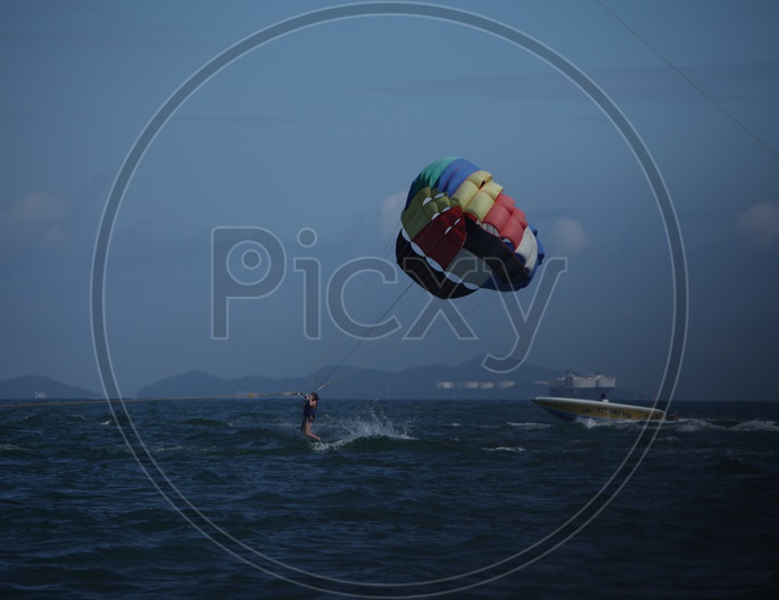 Image of Parasailing towed by motor boats-PJ139877-Picxy