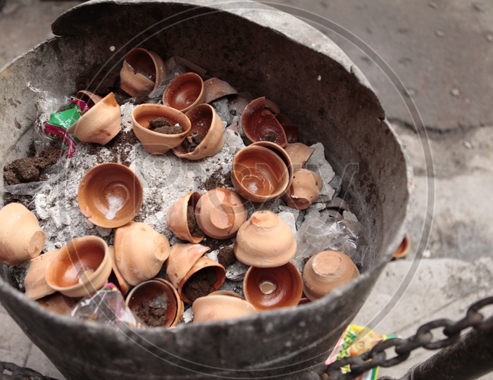 Image of Used Clay Tea Cups In Dustbin-NB422561-Picxy