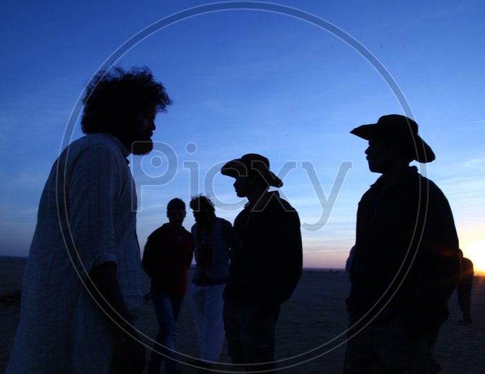 Image of people moving around at ruins of the desert-VW934598-Picxy