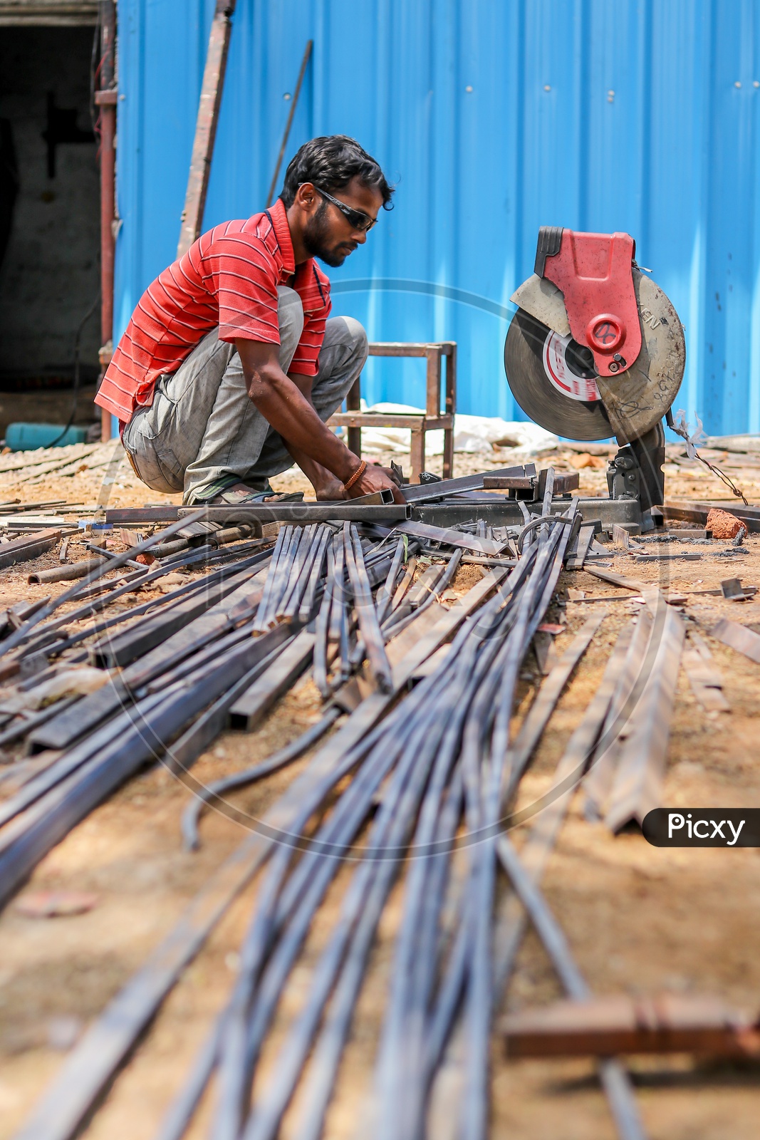 Image of Indian Cutter Worker cutting Iron Wedges with a Cutter ...