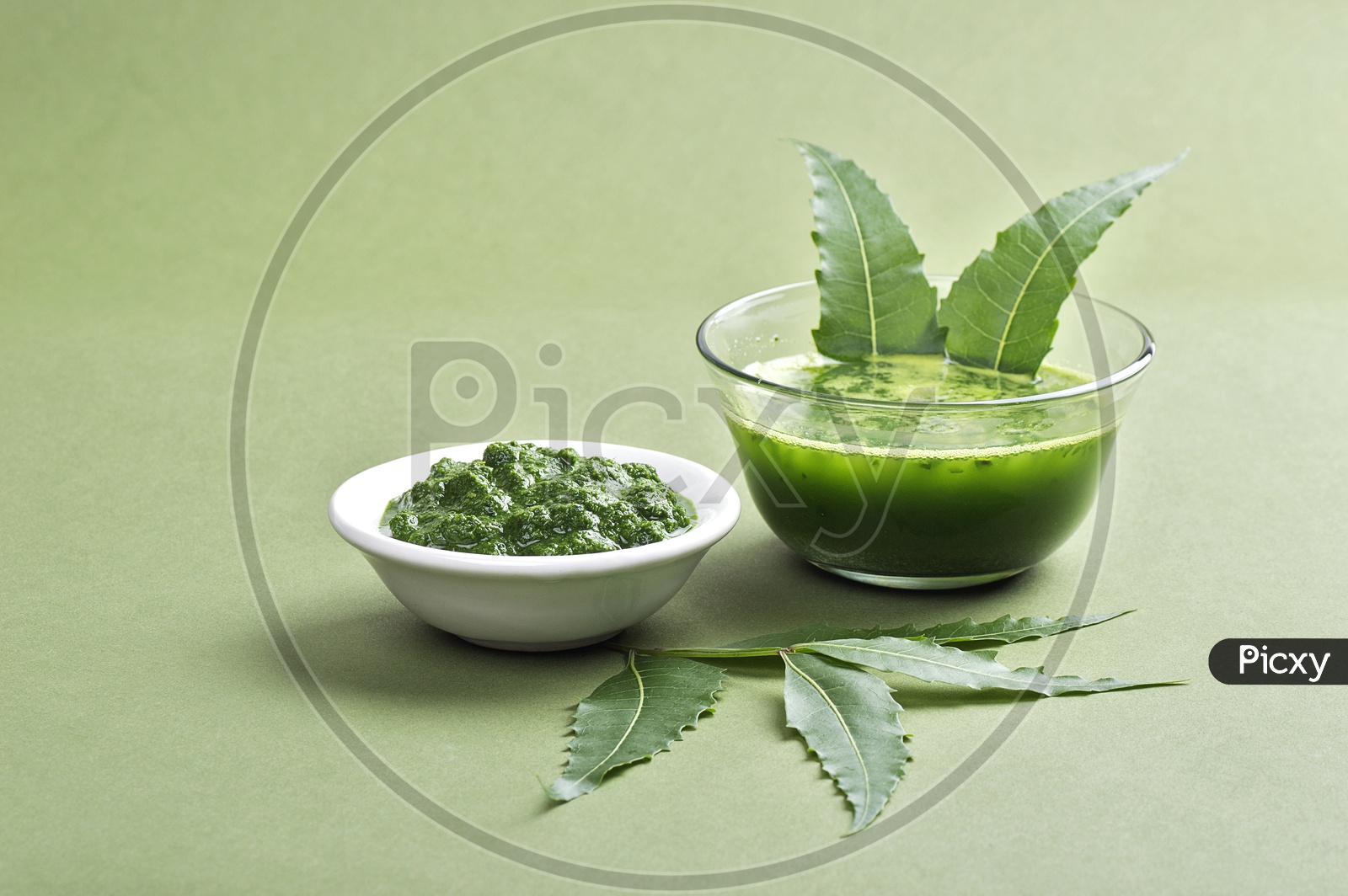 Image of Medicinal Neem leaves paste and juice with leaves on green ...