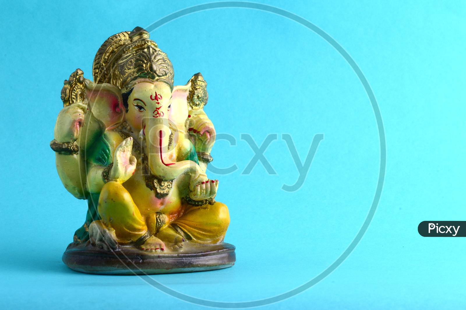 Image of Hindu God Ganesha or Ganapathi. Lord Ganesha Idol on Blue ...