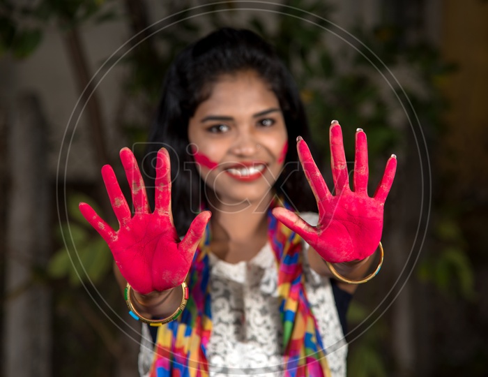 Image of Young Indian Girl showing Color Palm Celebrating Holi-YS975679 ...
