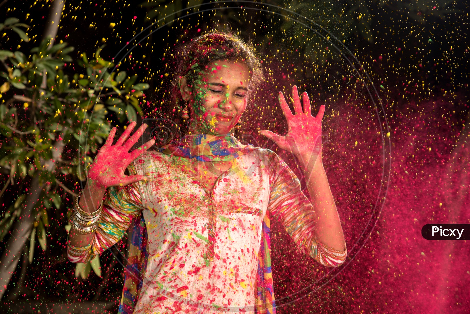 Image of Young Indian Girl Happily Playing With Colors Celebrating Holi ...