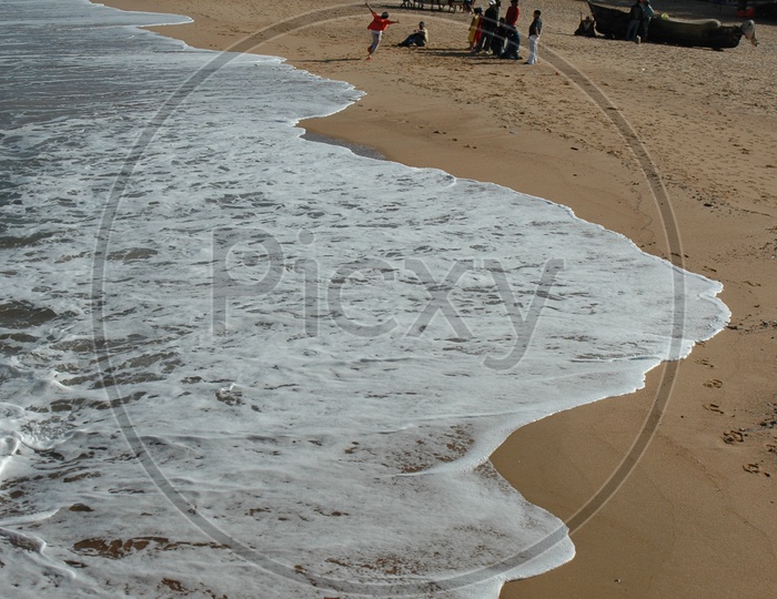 Image of Waves Touching The Beach Sand-IL528821-Picxy